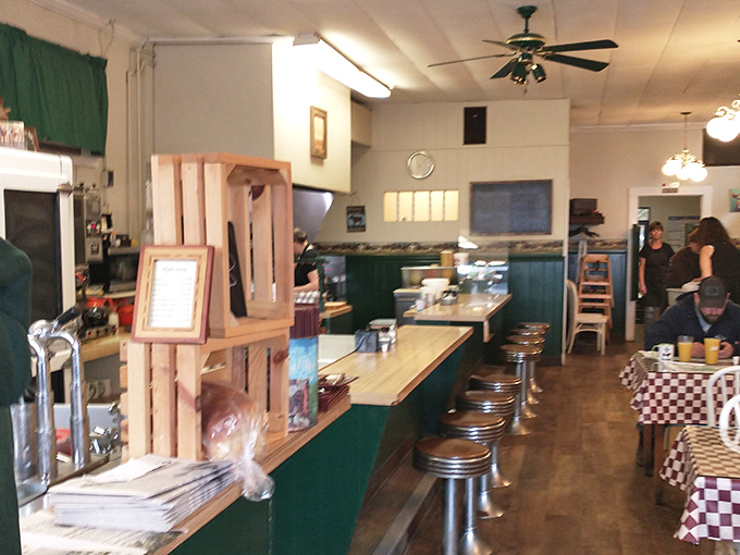 Classic diner layout with counter seating and tables creates the perfect backdrop for Newport's morning rituals.