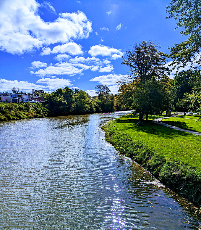 The Black River flows serenely below, providing a picturesque backdrop for selfies and creating that perfect "I'm-not-scared-you're-scared" moment.