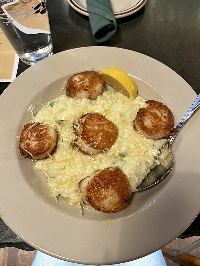 Scallops nestled in creamy risotto, each bite a perfect balance of sea and land. Vermont's answer to surf and turf.
