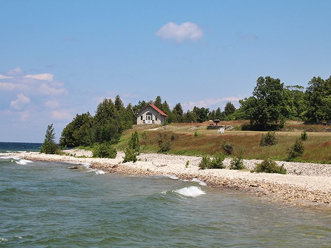 The meeting place of stone and water creates a natural artwork along Rock Island's shoreline, where each wave reshapes the ancient canvas.