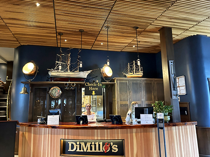 The reception area welcomes guests with model ships and maritime heritage &ndash; your seafood adventure begins here.