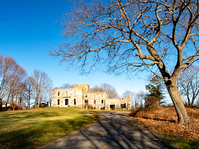 Winter's quiet beauty: Snow dusts the mansion ruins, highlighting architectural details against the stark seasonal landscape.