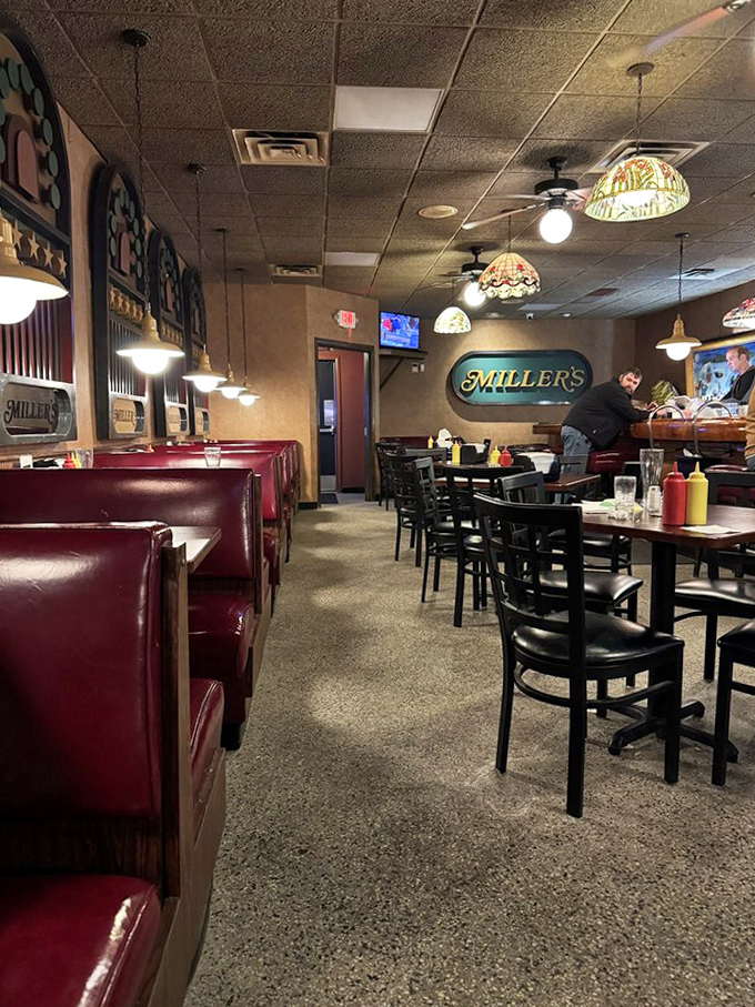 The dining area balances simplicity with comfort. Unpretentious tables and chairs where generations have enjoyed the perfect burger experience.