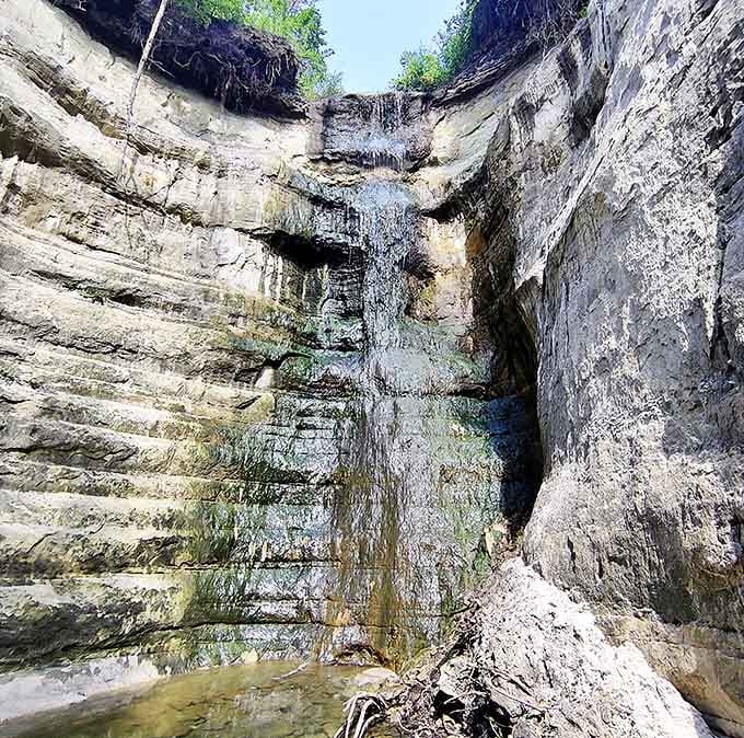 Look up from within the canyon's embrace to see a perfect slice of Minnesota sky framed by ancient stone walls.