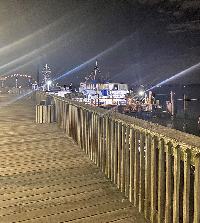 As night falls, John's Pass transforms into a twinkling wonderland where the day's adventures are retold over cold drinks and warm laughter.