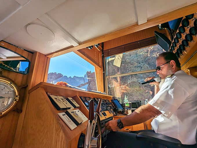 At the helm, experienced captains navigate Canyon Lake's scenic waterways with practiced ease and intimate knowledge of the terrain.