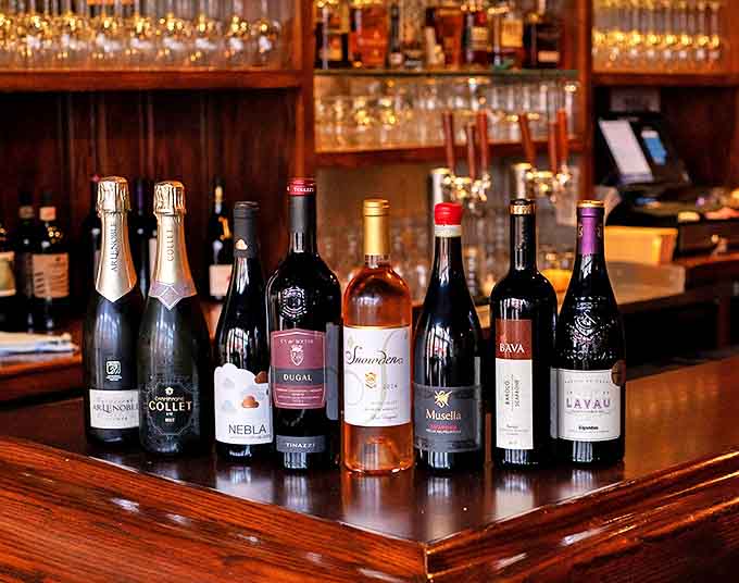 Wine bottles stand like soldiers at attention, ready to be drafted into service for your next dinner party.