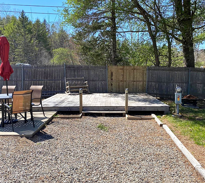 This wooden deck space transforms an ordinary campsite into an outdoor living room, where vacation memories take root.