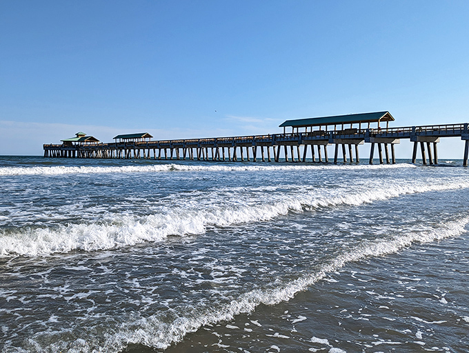 Folly Beach's inviting pier stretches into the Atlantic. The perfect spot for fishing, people-watching, or simply soaking in the ocean breeze.