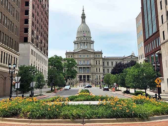 Lansing's magnificent State Capitol building stands proud at the end of a tree-lined boulevard, showcasing Michigan's governmental heart.