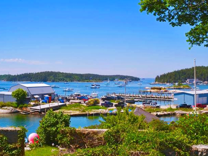 Stonington&rsquo;s buildings tumble gracefully toward the harbor, forming a lively seaside tableau that captures the spirit of a working fishing village.