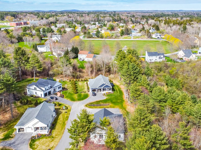 The wooded landscape of Cumberland Foreside conceals luxury homes while showcasing Maine's abundant natural beauty.