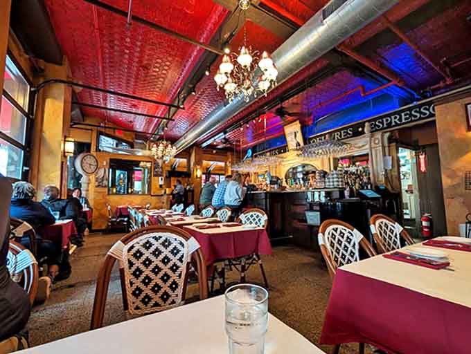 The vintage tin ceiling and warm lighting create an authentic bistro atmosphere that transports you straight to Paris.