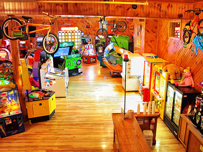 The arcade area transforms adults into kids and kids into competitive champions – quarters disappear faster than the nachos.