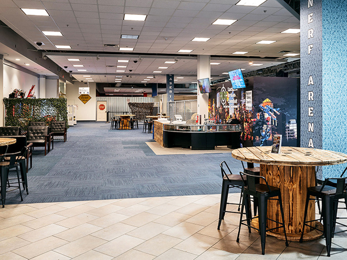 The facility's open layout allows spectators to watch the action unfold, often inspiring reluctant observers to join the next round.