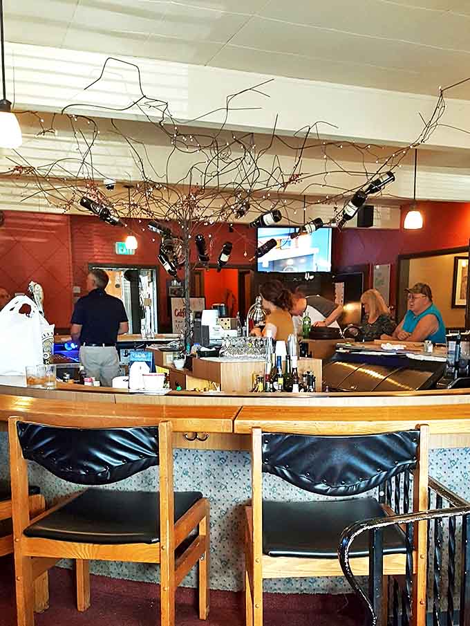 The turquoise-topped tiki bar serves as Fishack's social hub, where tropical drinks and local brews turn ordinary evenings into mini-vacations.