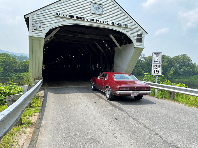 Classic cars and classic architecture – a perfect pairing as this vintage beauty cruises through America's longest wooden covered bridge.