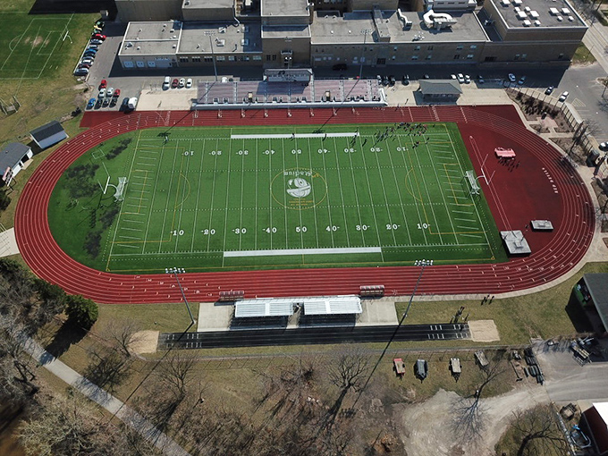 City Stadium stands ready for Friday night lights and Saturday morning games, where community spirit is measured in cheers rather than scoreboards.
