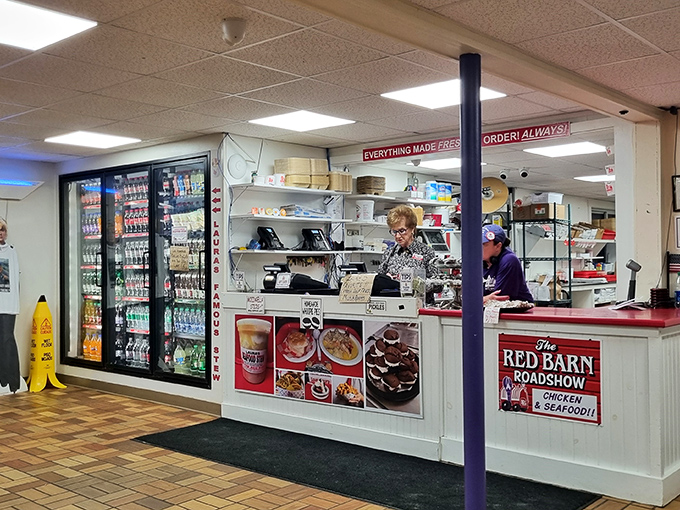 The bustling counter where magic happens – every order made fresh while friendly staff keep the seafood flowing.