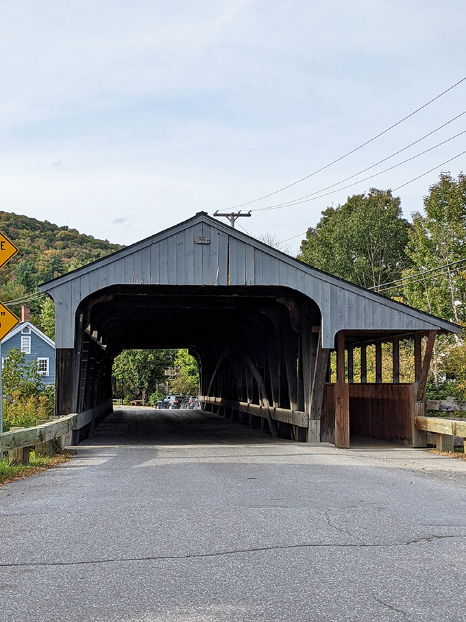 This covered bridge stands as a wooden time machine, sheltering travelers just as it has for generations through countless Vermont seasons.