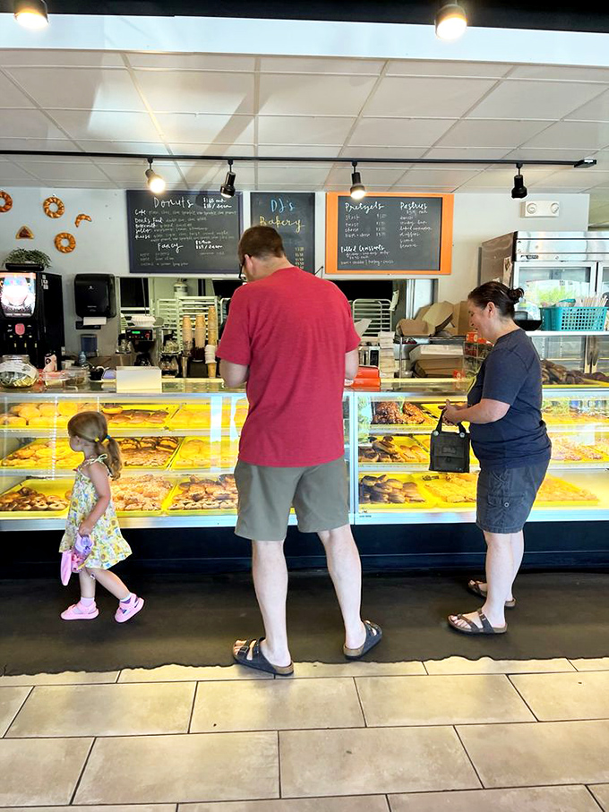 The morning pilgrimage&mdash;families making memories one donut at a time in this unassuming temple of fried dough.