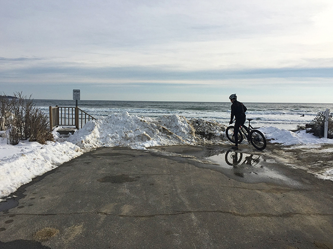 Winter's quiet beauty transforms Higgins Beach, offering solitary moments for contemplation and coastal exploration.
