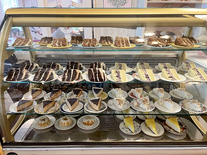 Not so much a dessert case as a glass-enclosed museum of buttercream architecture and pastry perfection.