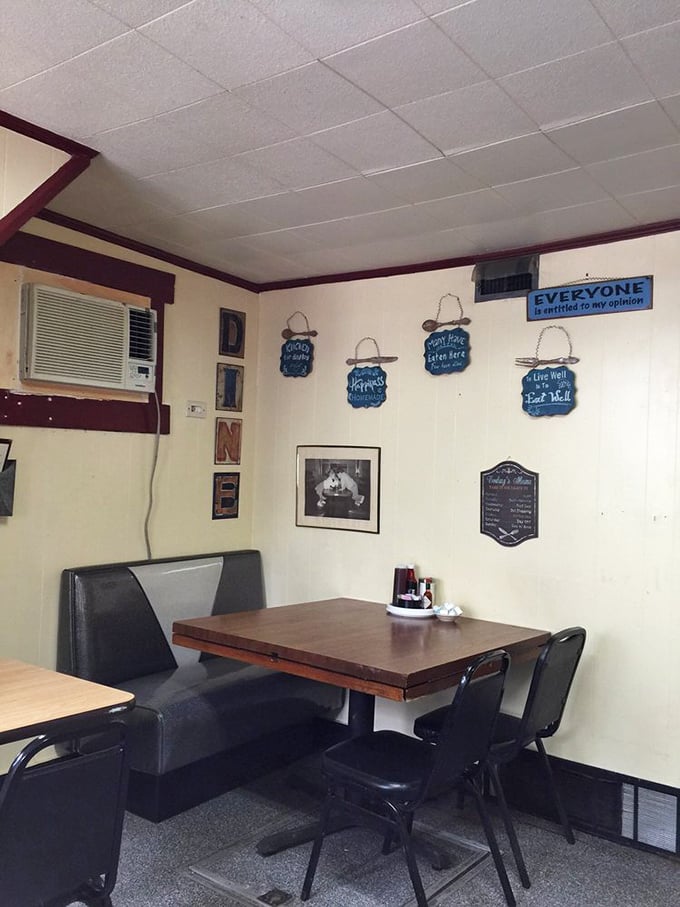 Cozy booth seating where countless conversations and connections have happened over steaming plates of comfort food.