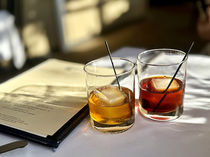 Craft cocktails catching the afternoon light &ndash; liquid amber in a glass, the perfect prelude to an exceptional meal.