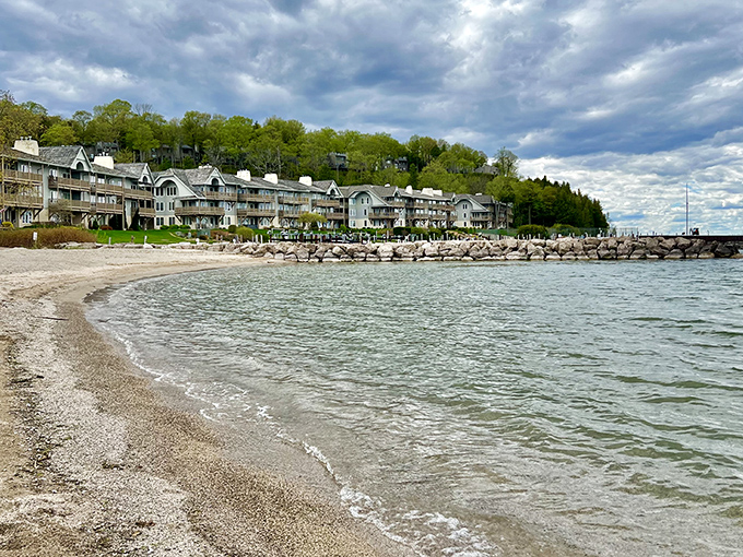 Fish Creek Beach offers gentle waves and golden sand, where families create memories against a backdrop of shoreline homes.