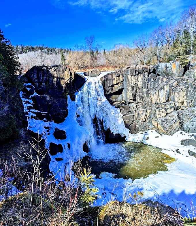 Winter's artistic touch transforms the falls into a frozen sculpture garden, where water and ice dance together in a breathtaking seasonal performance.