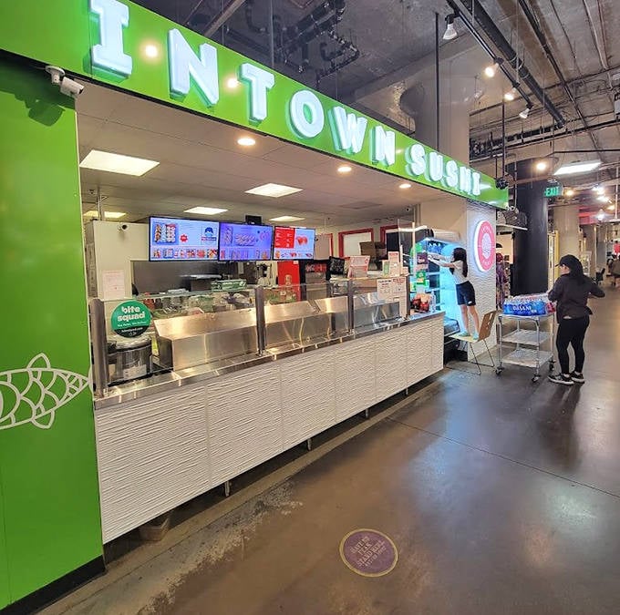 Intown Sushi's bright green stall promises ocean-fresh flavors that transport you straight to Tokyo's fish markets.
