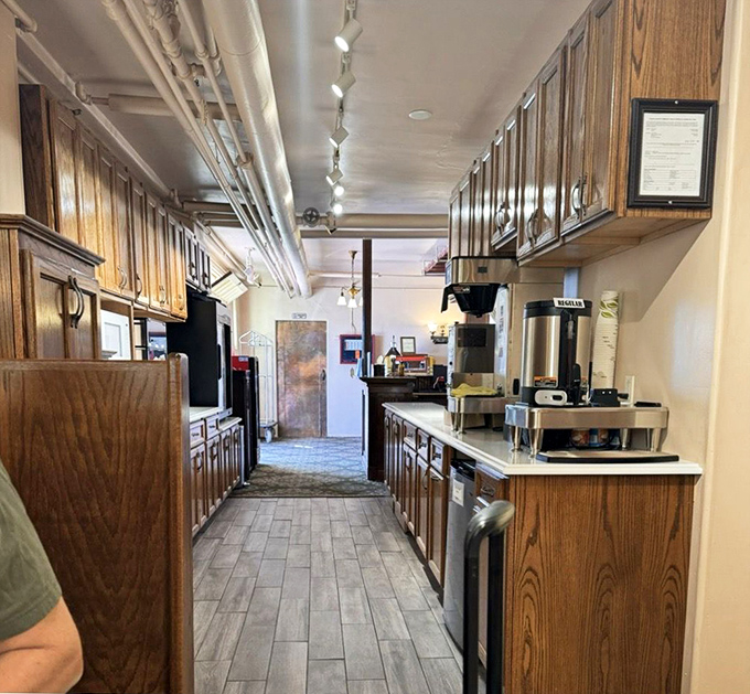 The kitchen area maintains its vintage charm while offering modern amenities – though staff occasionally report utensils that rearrange themselves overnight.