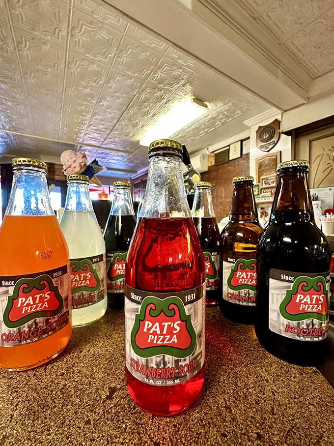 Pat's signature sodas in glass bottles – a rainbow of flavors that transport you back to simpler times.