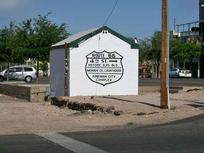 Route 66 signage points the way to local attractions, helping visitors navigate this slice of Americana.