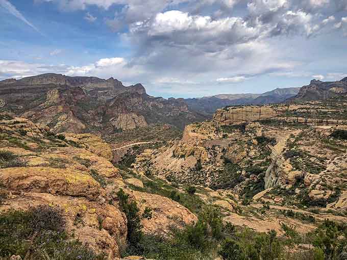 The Apache Trail reveals its dramatic character through sweeping canyon vistas that make every curve worth the careful navigation.
