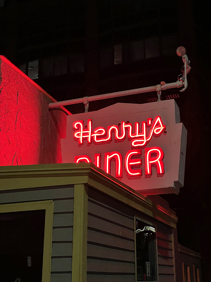 After dark, that neon glow transforms from simple signage to a lighthouse for the hungry, beckoning comfort-seekers from blocks away.