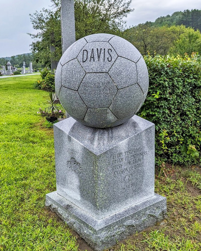 Game on for eternity! This soccer ball monument kicks conventional cemetery expectations downfield with sporting spirit carved in stone.