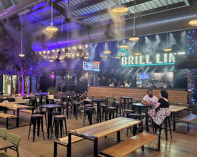 The Brill Line's illuminated sign beckons hungry visitors with promises of comfort food elevated to art form status.