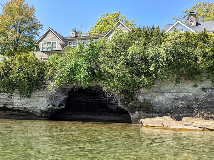 Hidden shoreline caves offer cool respite and unique perspectives, secret spaces carved by the same patient waters that shaped Turnip Rock itself.