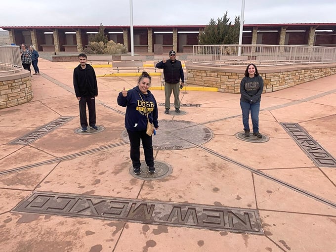 Visitors position themselves across the four state boundaries, creating memories and geographical magic in equal measure.