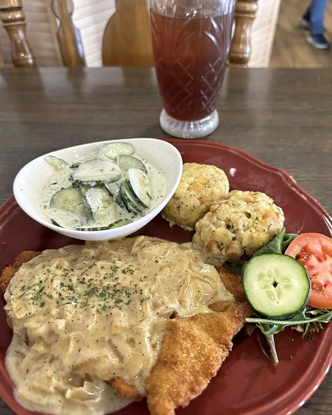 Zwiebel Rahm Schnitzel under a blanket of velvety onion cream gravy &ndash; the kind of dish that makes you close your eyes with each heavenly bite.