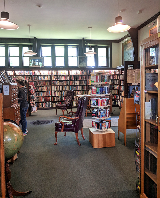 Rich wood paneling and thoughtful lighting create the perfect ambiance for losing yourself in a good book for hours on end.