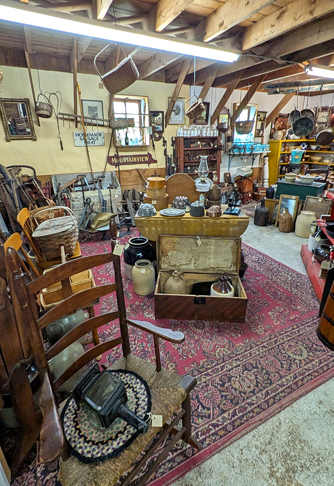 This cozy nook showcases centuries of craftsmanship, where handmade chairs and weathered trunks tell stories of the families who once treasured them.