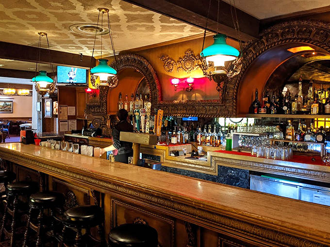 The bar's ornate woodwork and vintage mirrors have witnessed countless toasts and whispered conversations since the 19th century.