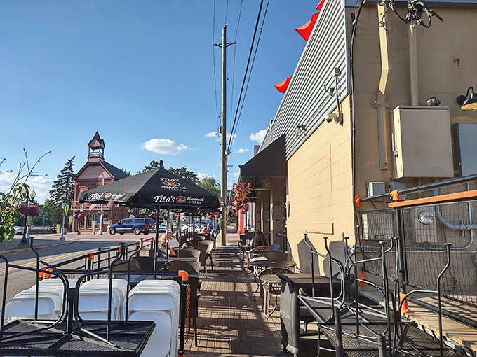 The street-level patio offers prime people-watching along Brighton's Main Street, where every passerby envies your mountain of food.
