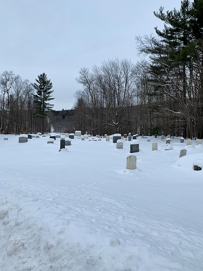 Headstones peek through winter's blanket, telling stories of lives lived in this unique borderland where two countries gently meet.