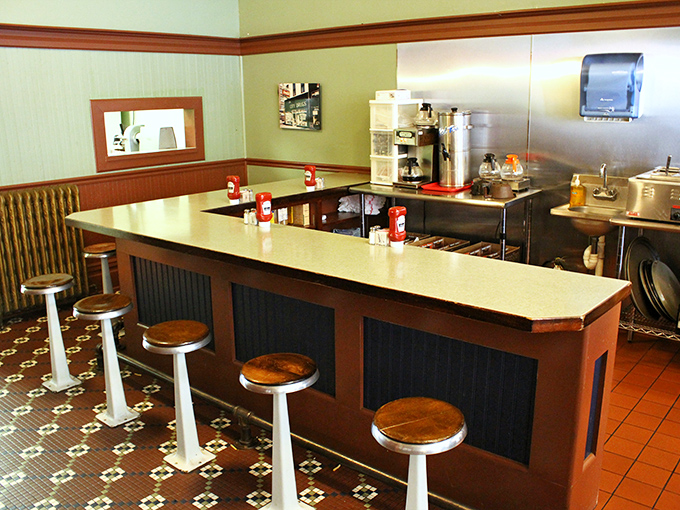 Counter seating with classic stools invites you to sit, stay awhile, and become part of the daily rhythm.