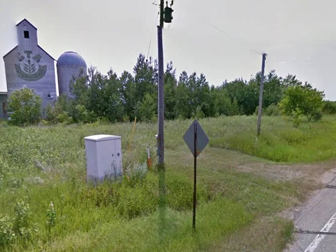 Tall grasses frame the approach to Dorothy, their gentle swaying creating a hypnotic welcome to this pocket of preserved prairie life.