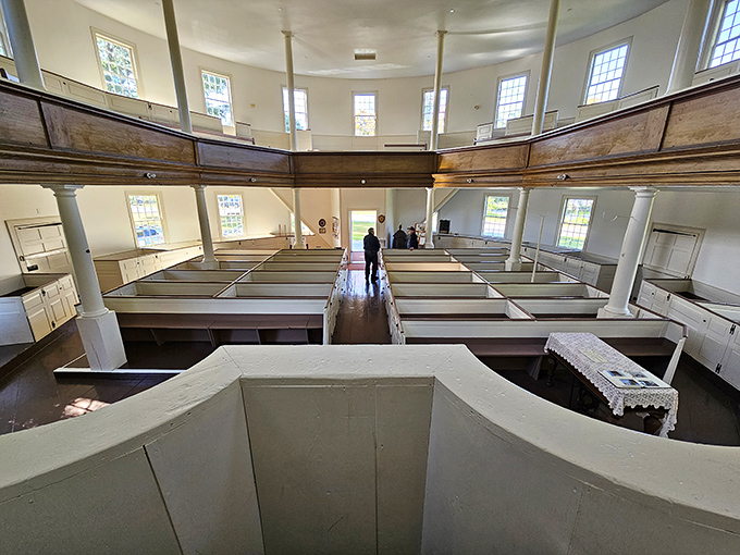Looking down from the balcony reveals the church's ingenious design, where every seat offers a clear view of the central pulpit.